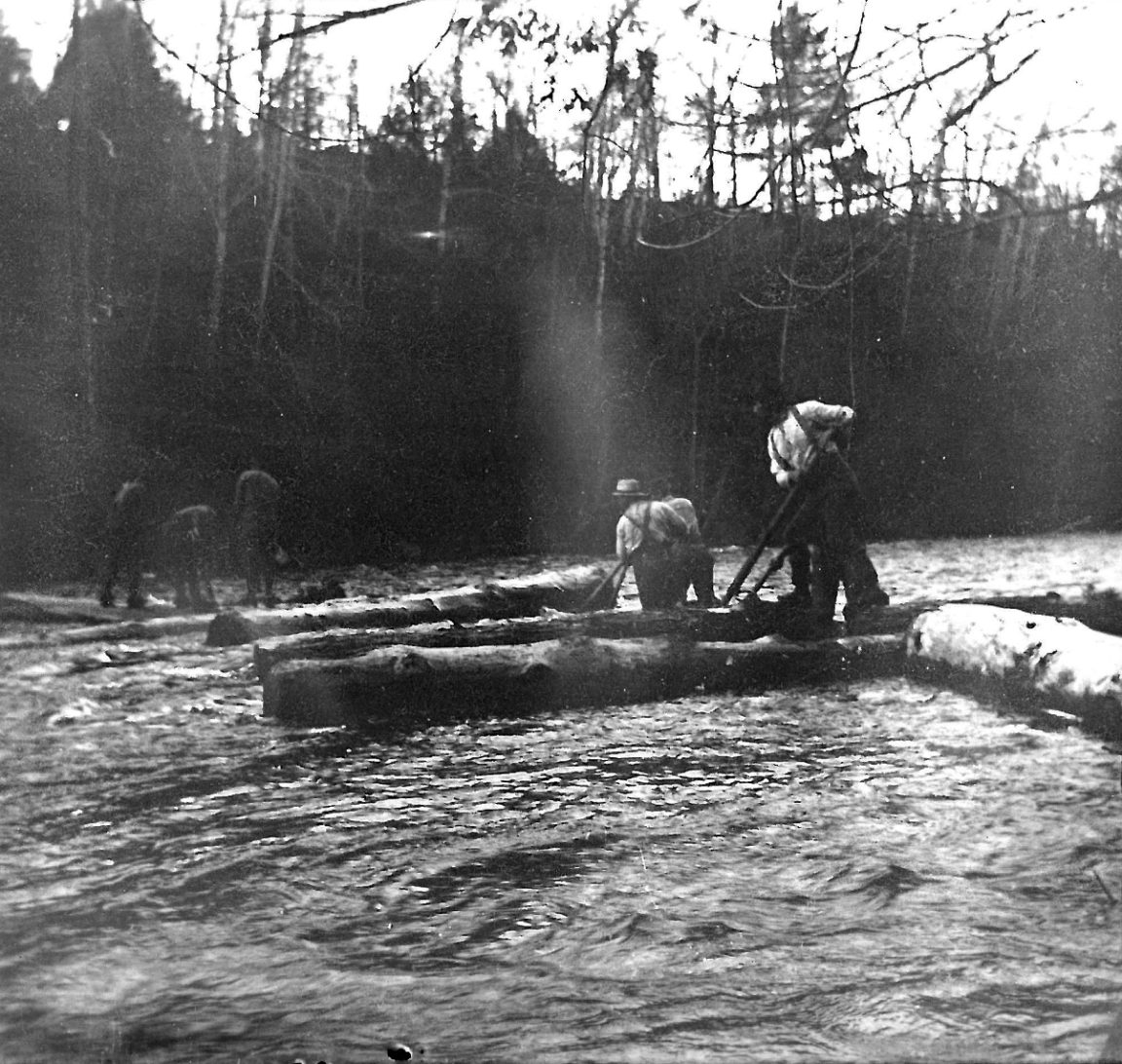 Men running logs in Saint Lawrence County