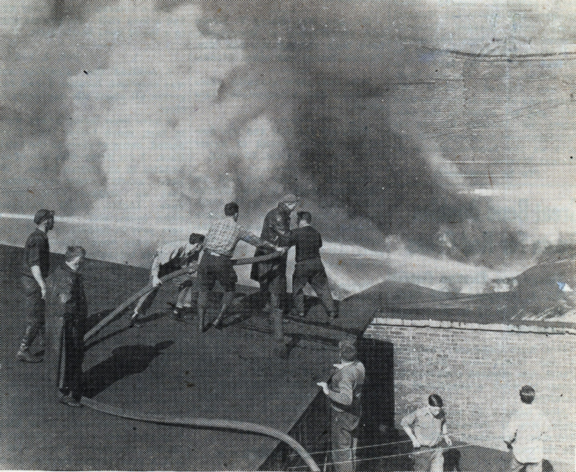 Firemen fight Strand Building fire in Carthage