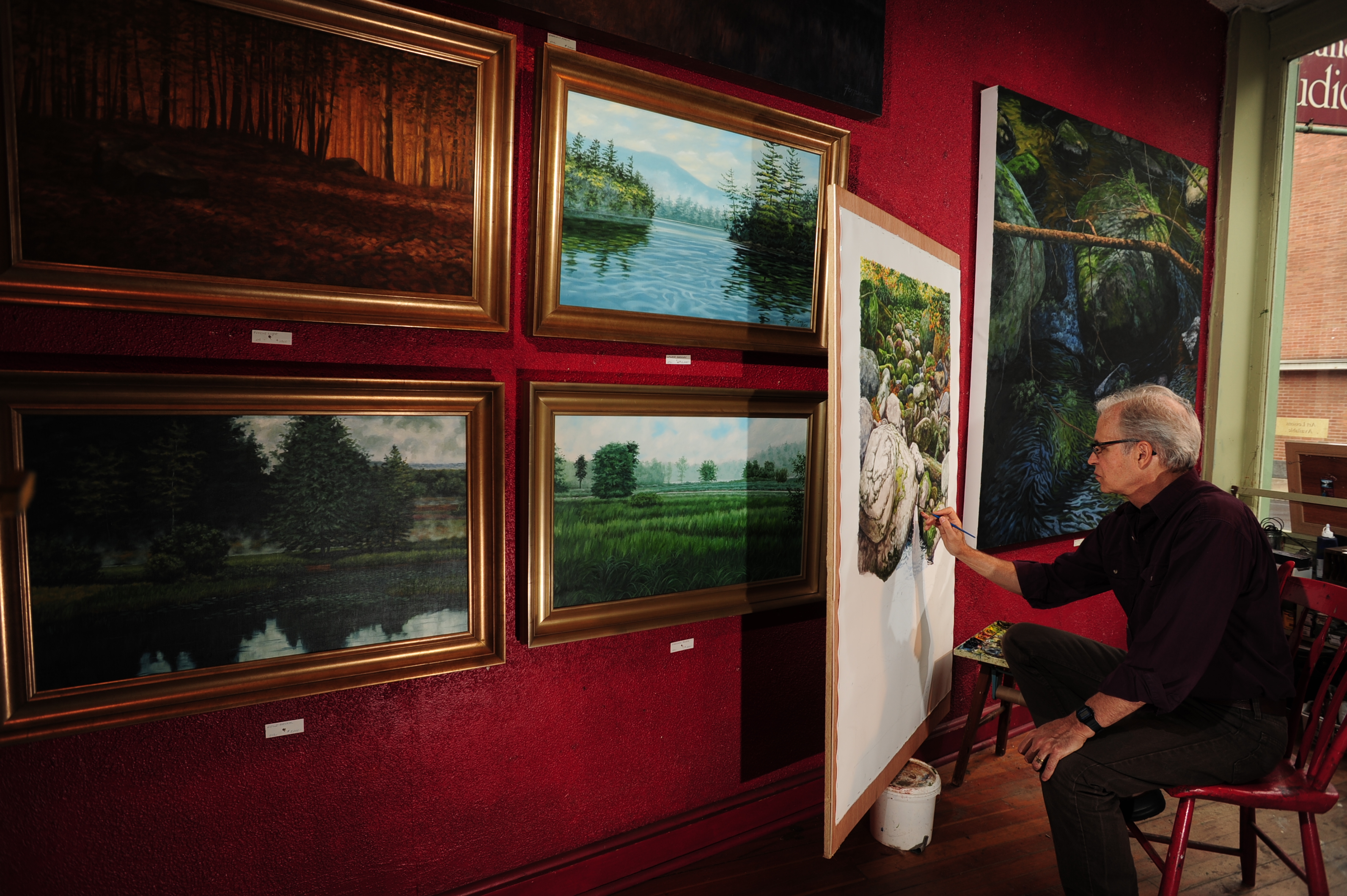 Artist Tim Fortune at work in his studio in Saranac Lake