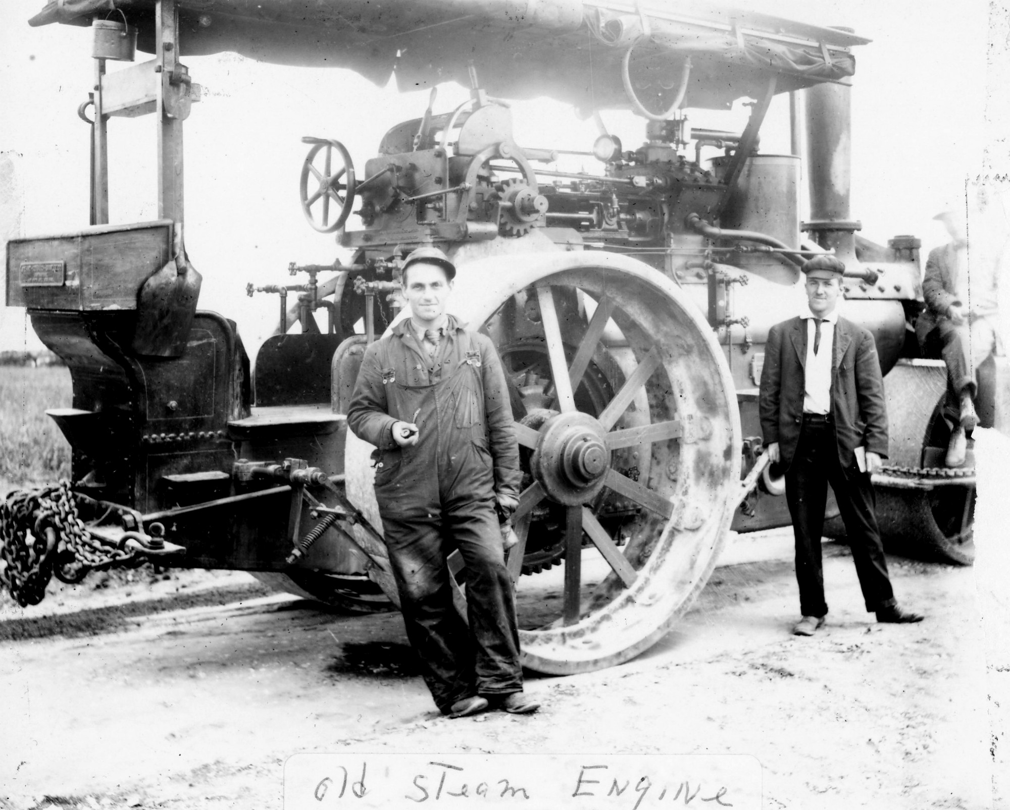 Sawmill workers with coal-fired steam locomotive near Harrisville