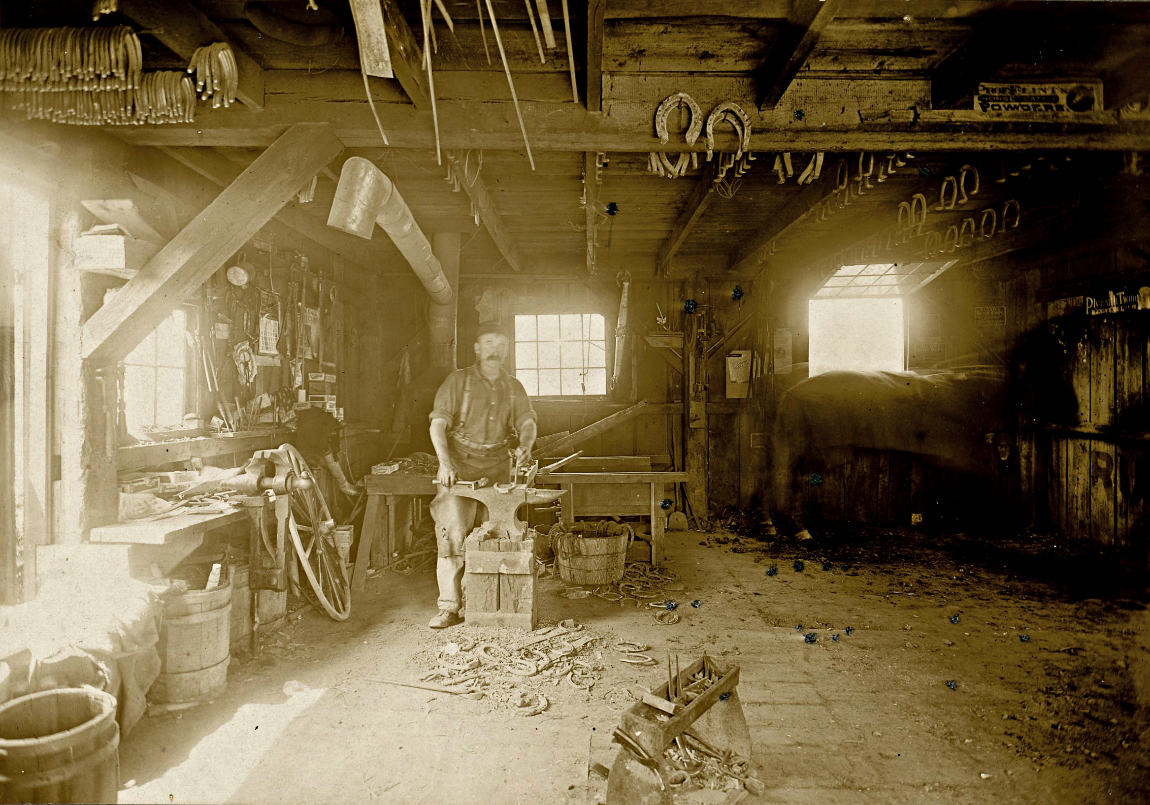 Blacksmiths at work inside their shop in Hammond