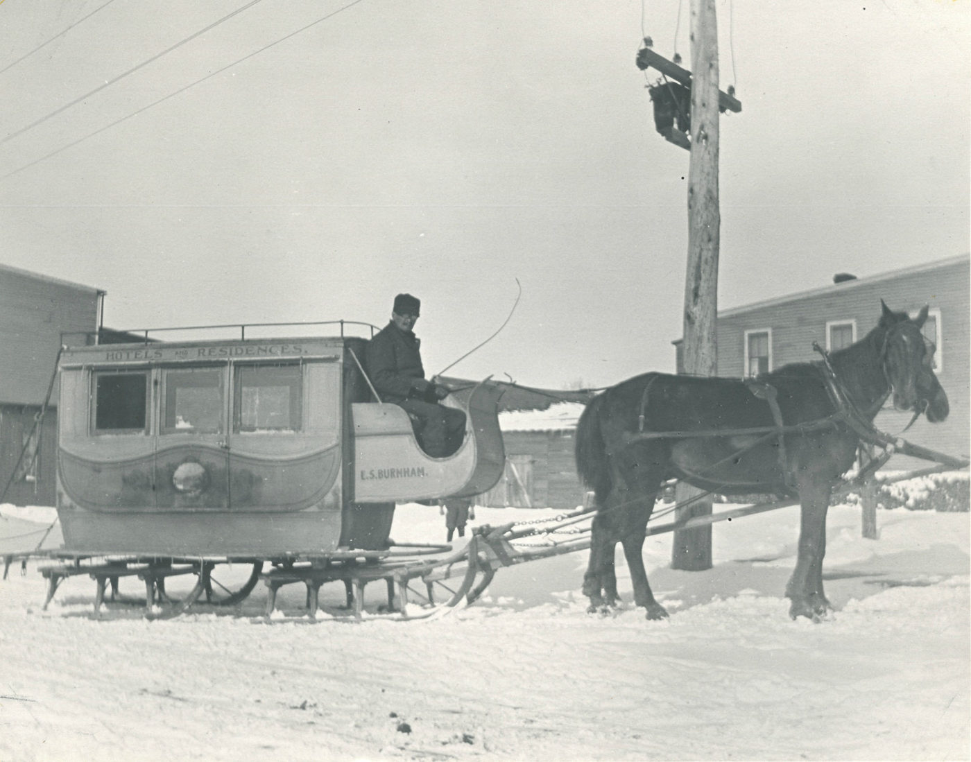 E.S. Burnham stagecoach on runners in De Kalb Junction