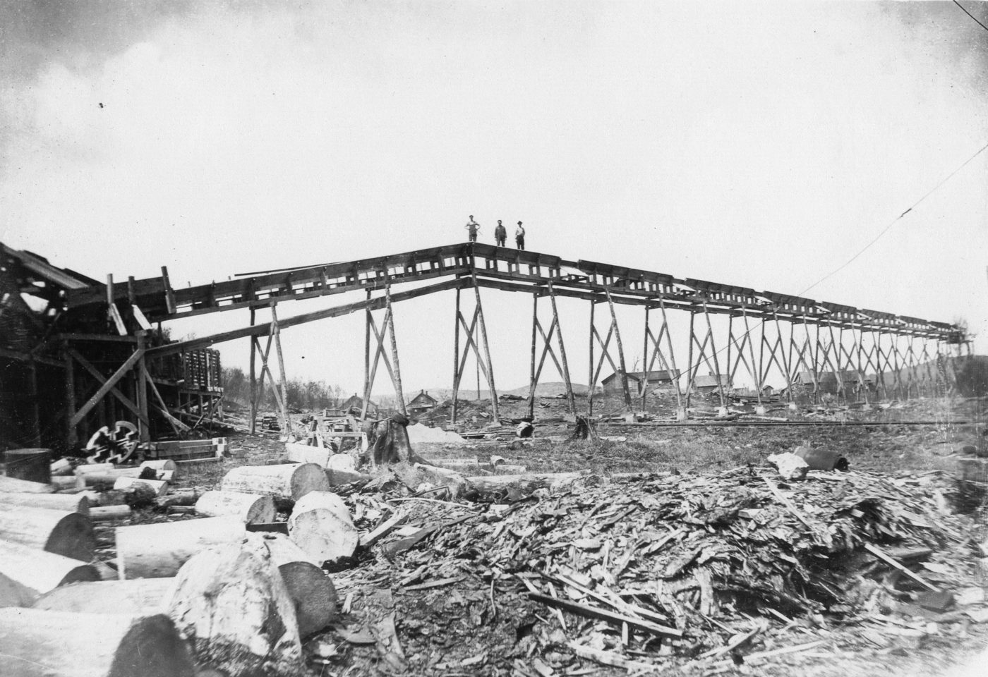 Workers on a log flume at the Harrisville Lumber Company