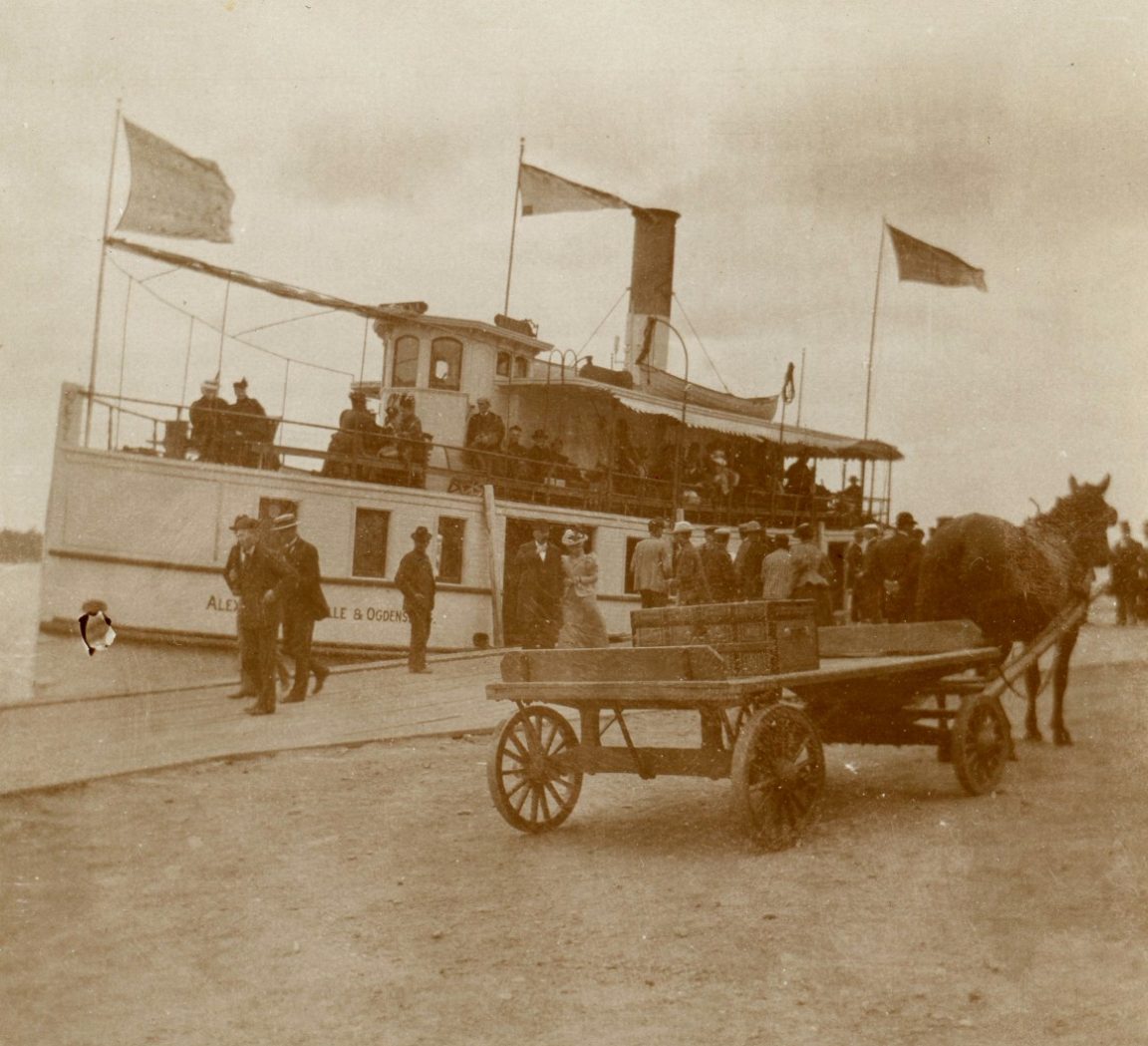 Livery wagon in front of a docked ferry in Ogdensburg