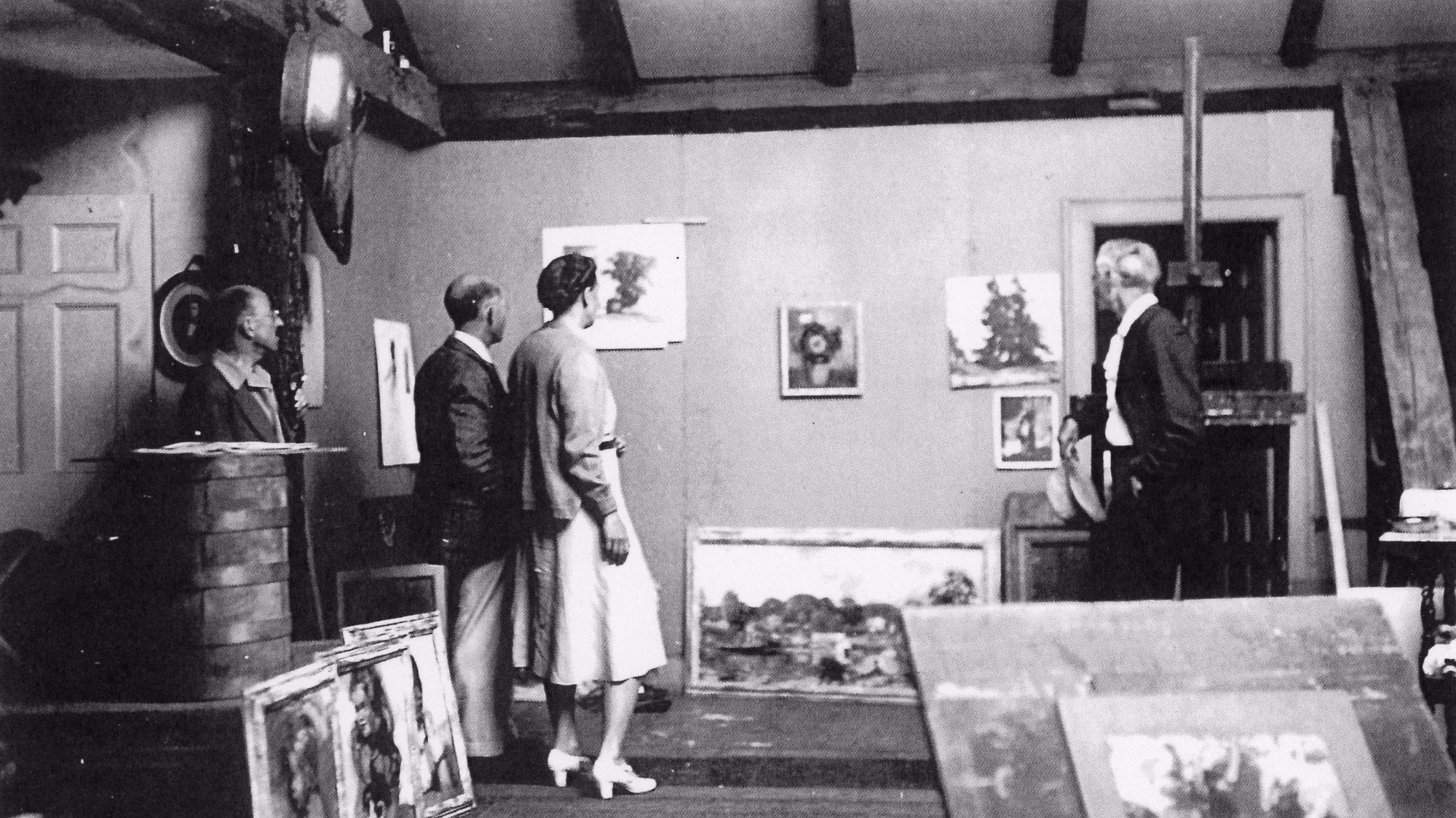 Charles Chapman showing paintings in studio in Morristown