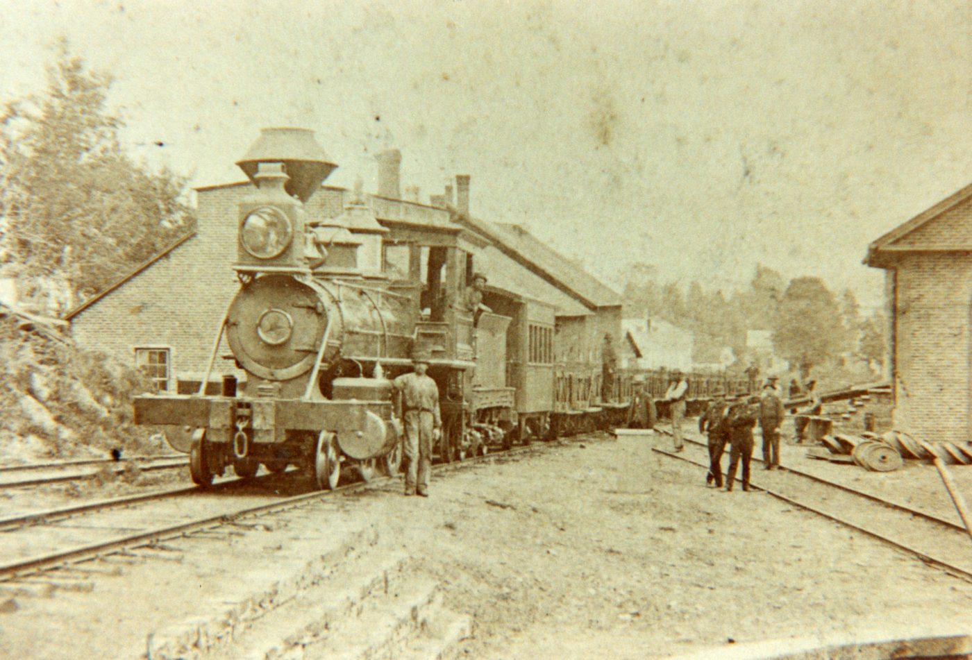 Steam locomotive in rail yard near Lake Champlain
