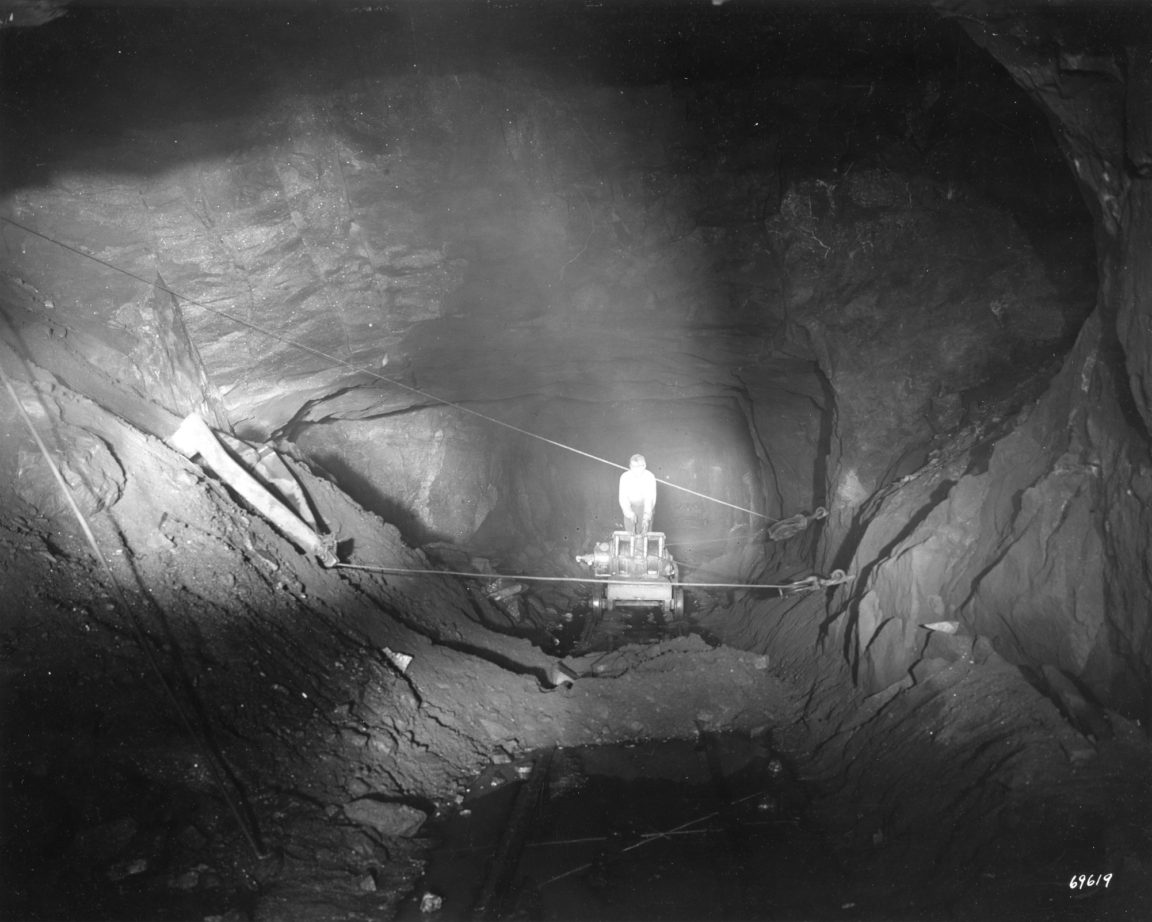 Miner using a scraper in Republic Steel mine in Mineville