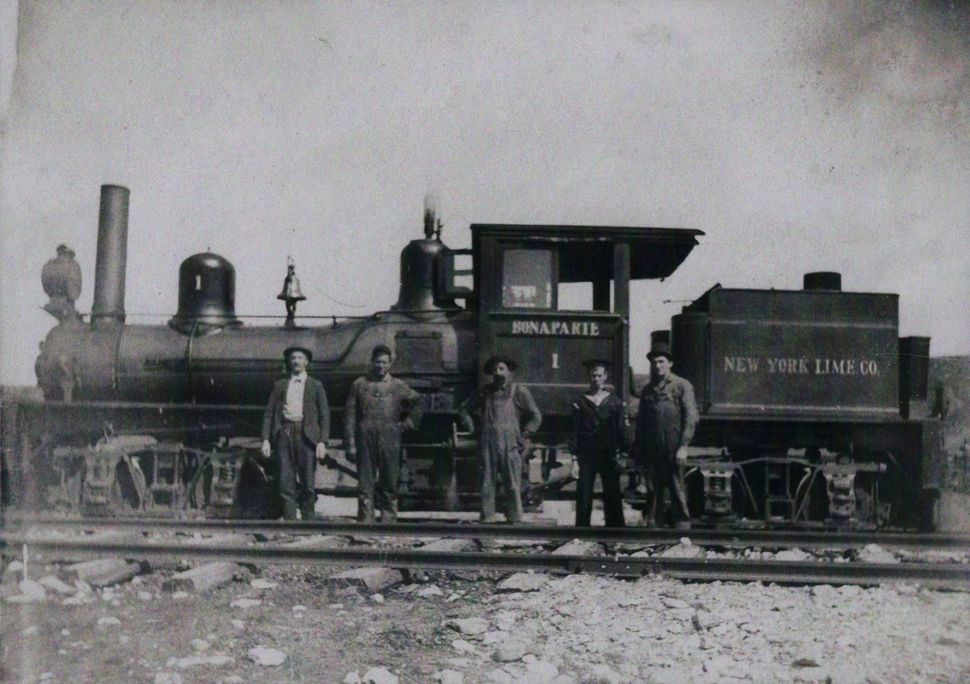 Train crew with engine and coal tender in Natural Bridge