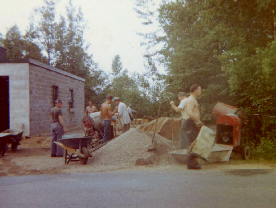 Smoothing the foundation of the Cranberry Lake Fire Hall in Cranberry ...