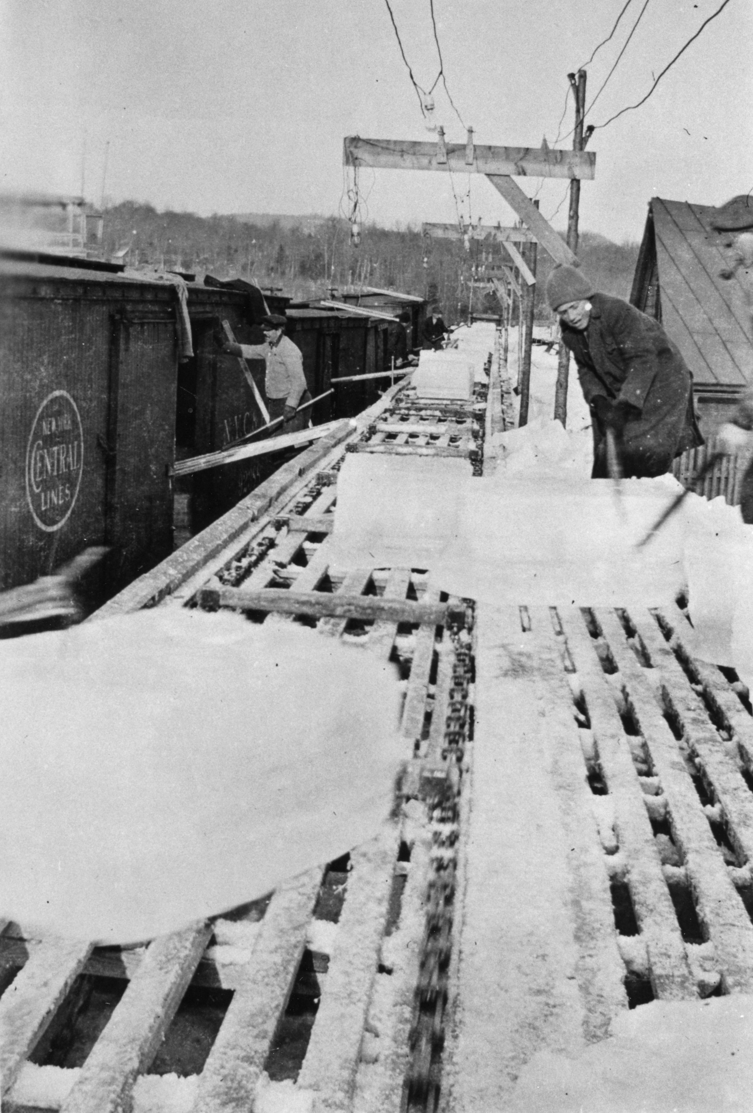 Loading ice blocks into train cars in Old Forge