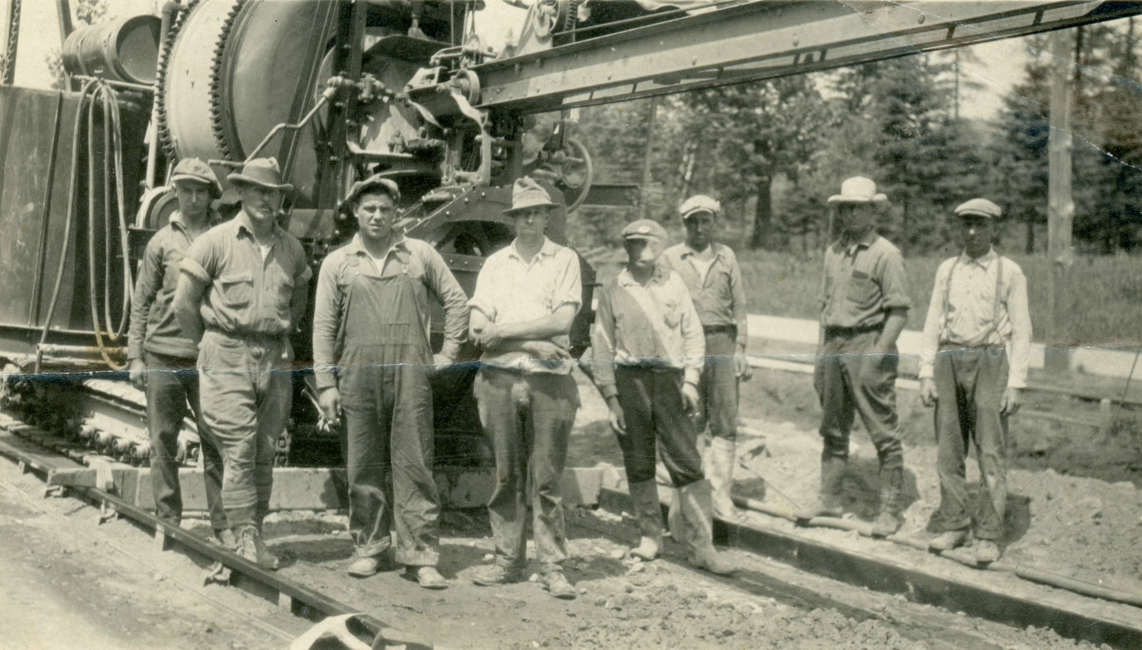 Road crew laying concrete road in Town of Webb