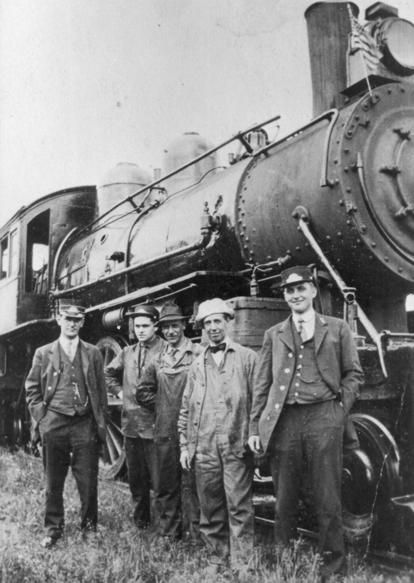 Railroad engine and crew of five in the Town of Webb