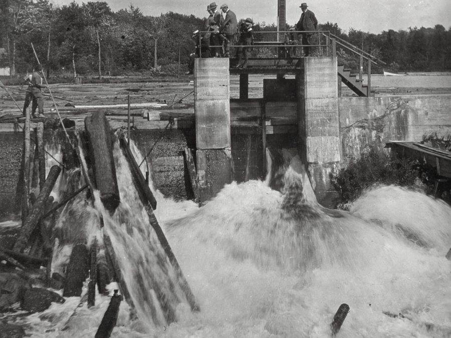 Workers on a log flume at the Harrisville Lumber Company