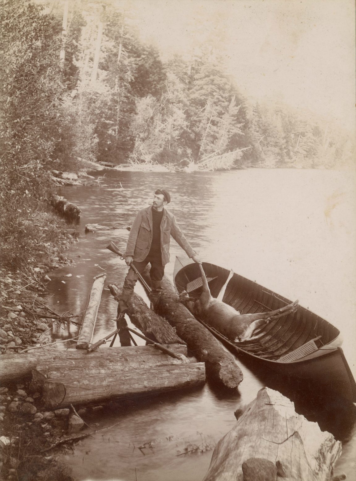 An Adirondack guide and his guide boat at Twitchell Lake in the Town of ...
