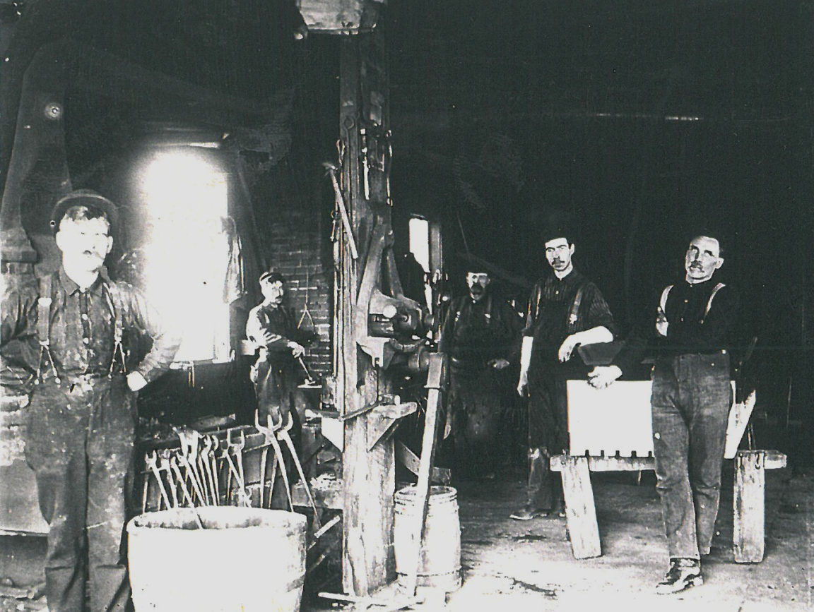 Workers inside Henry Jones General Blacksmith and Machine Shop in ...