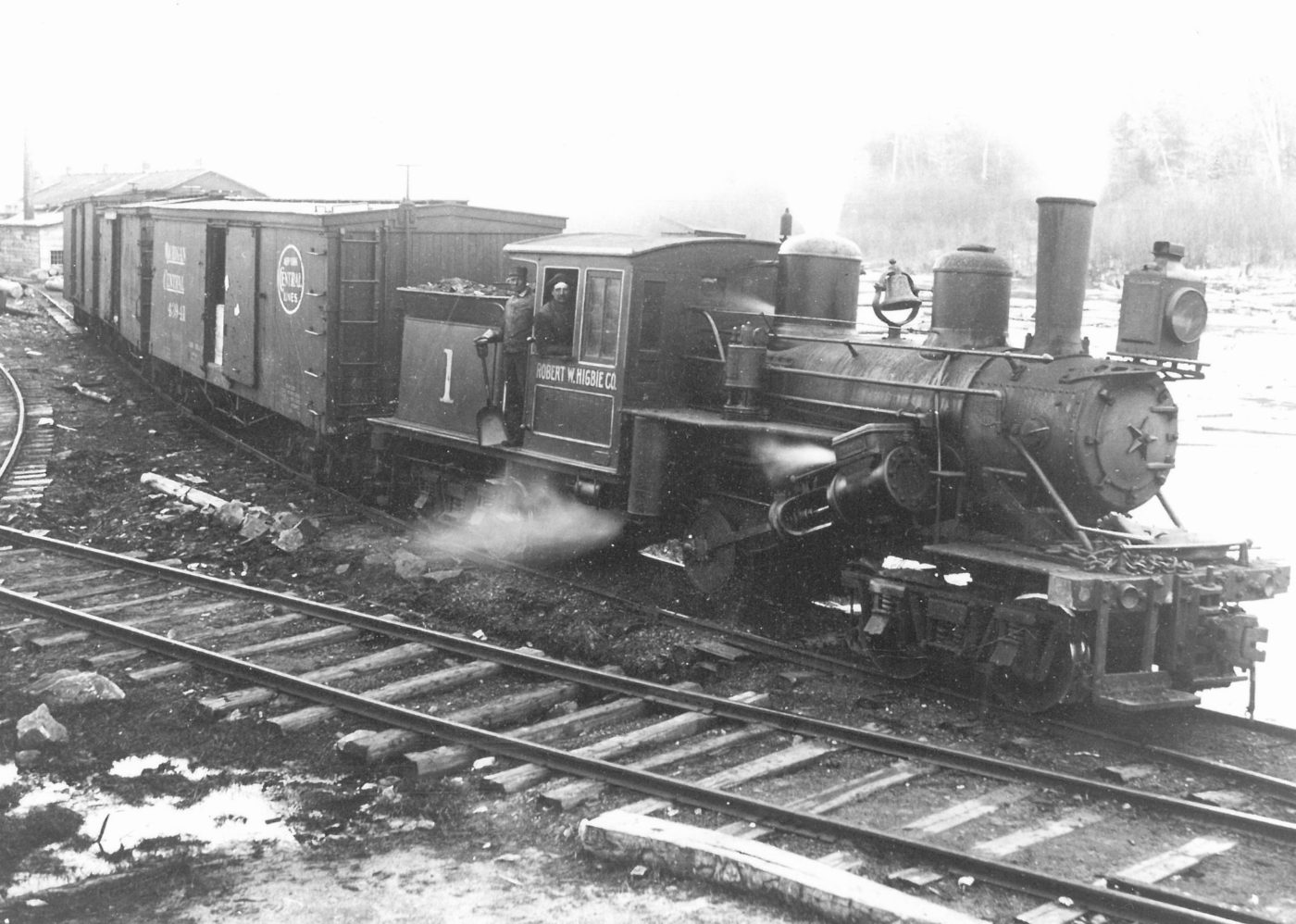 Lumber company workers on steam locomotive in Newbridge
