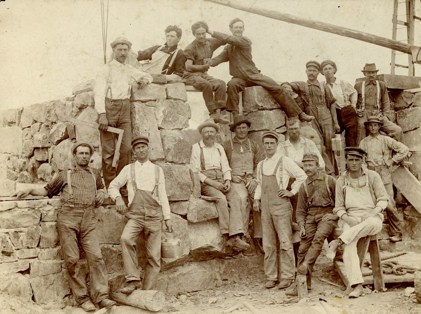 Stone workers pose with foundation in Hermon