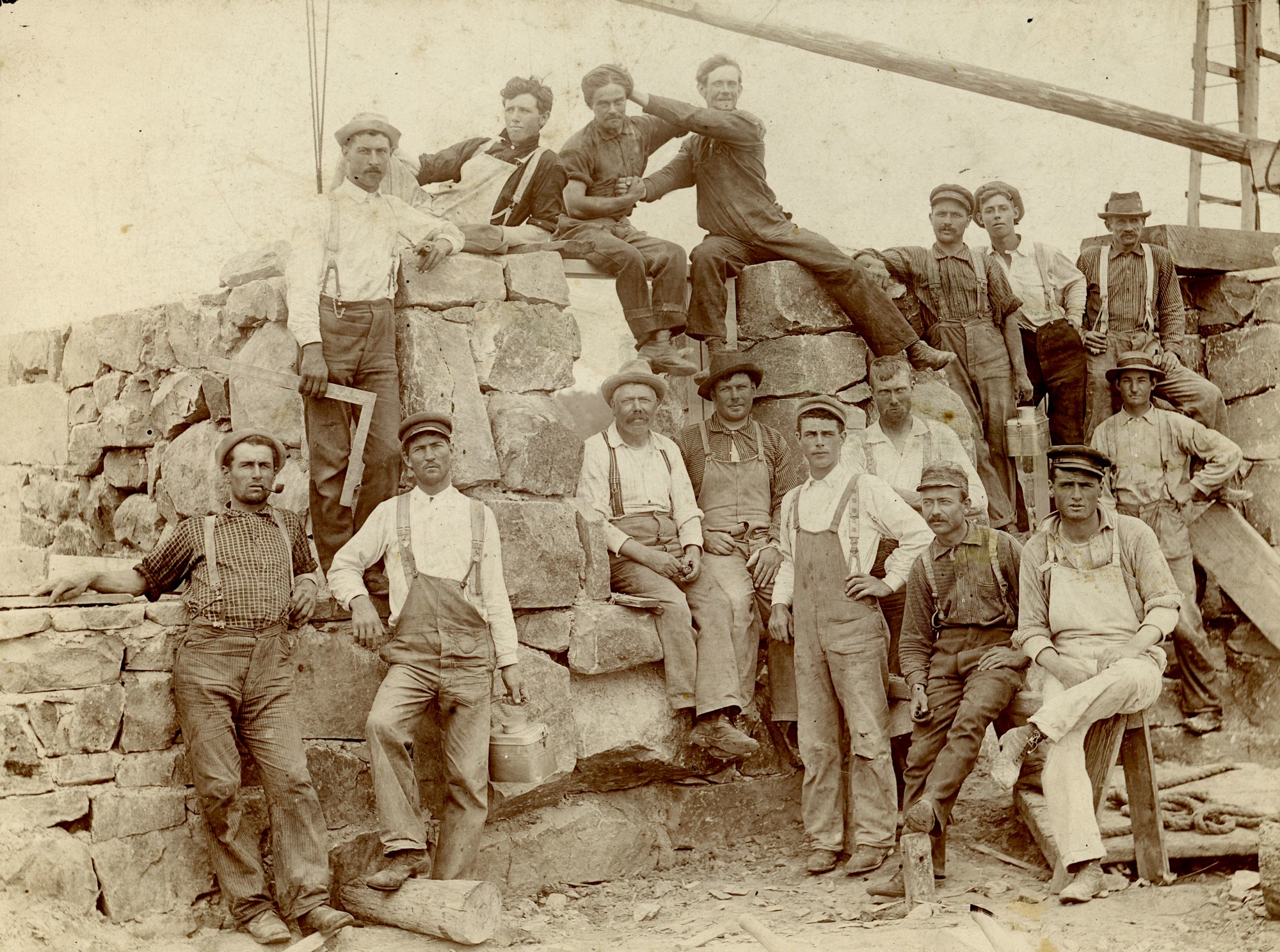 Stone workers pose with foundation in Hermon