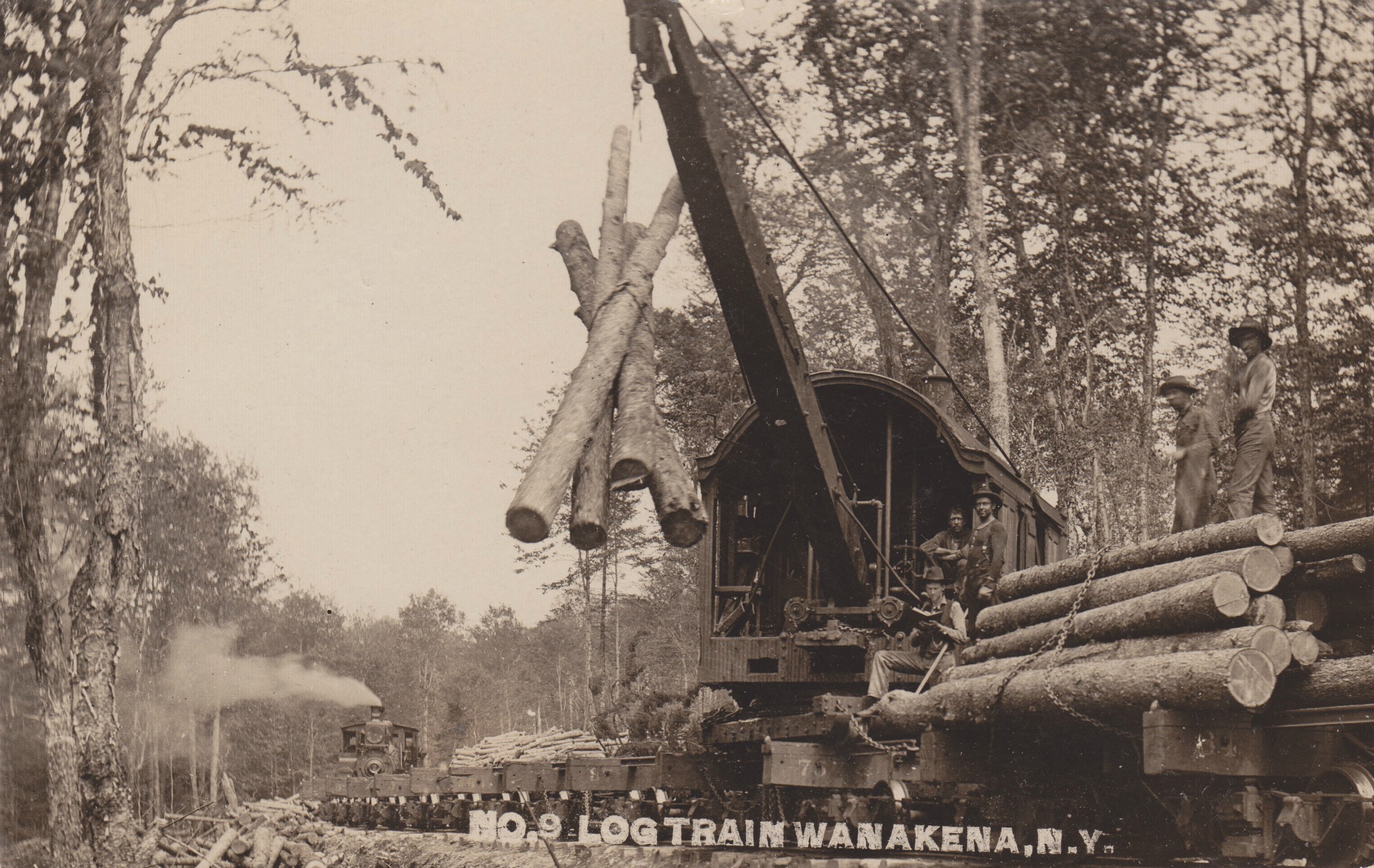 Log train hoisting logs in Wanakena