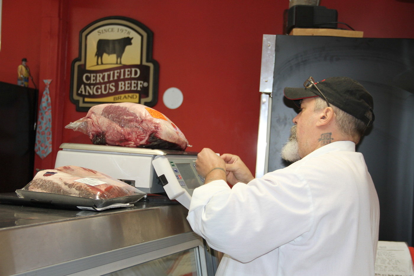 Pricing meat in Walker’s Neighborhood Butcher Shop in Lake Placid