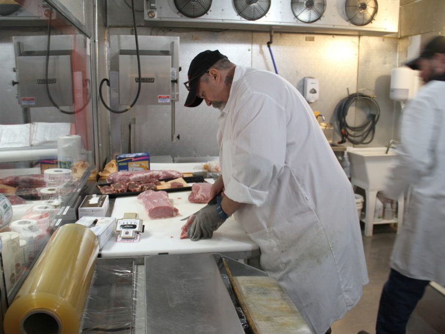 Pricing meat in Walker’s Neighborhood Butcher Shop in Lake Placid
