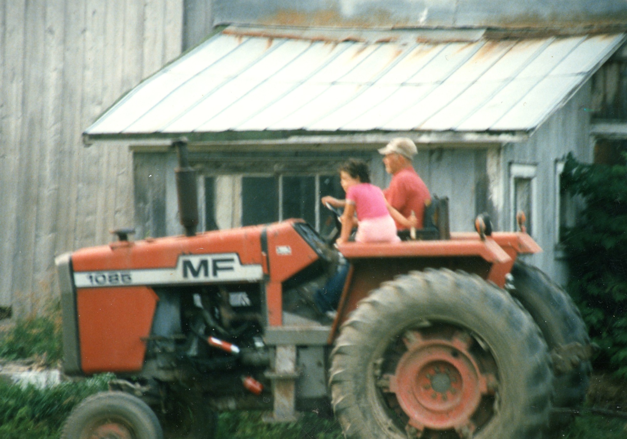 Driving a Massey Ferguson 1085 tractor on the Cuthbert Farm in Hammond