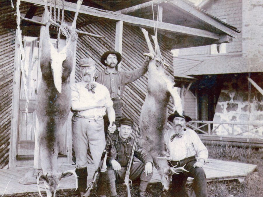 Adirondack hunting guides in front of Howland’s Camp in the Adirondacks