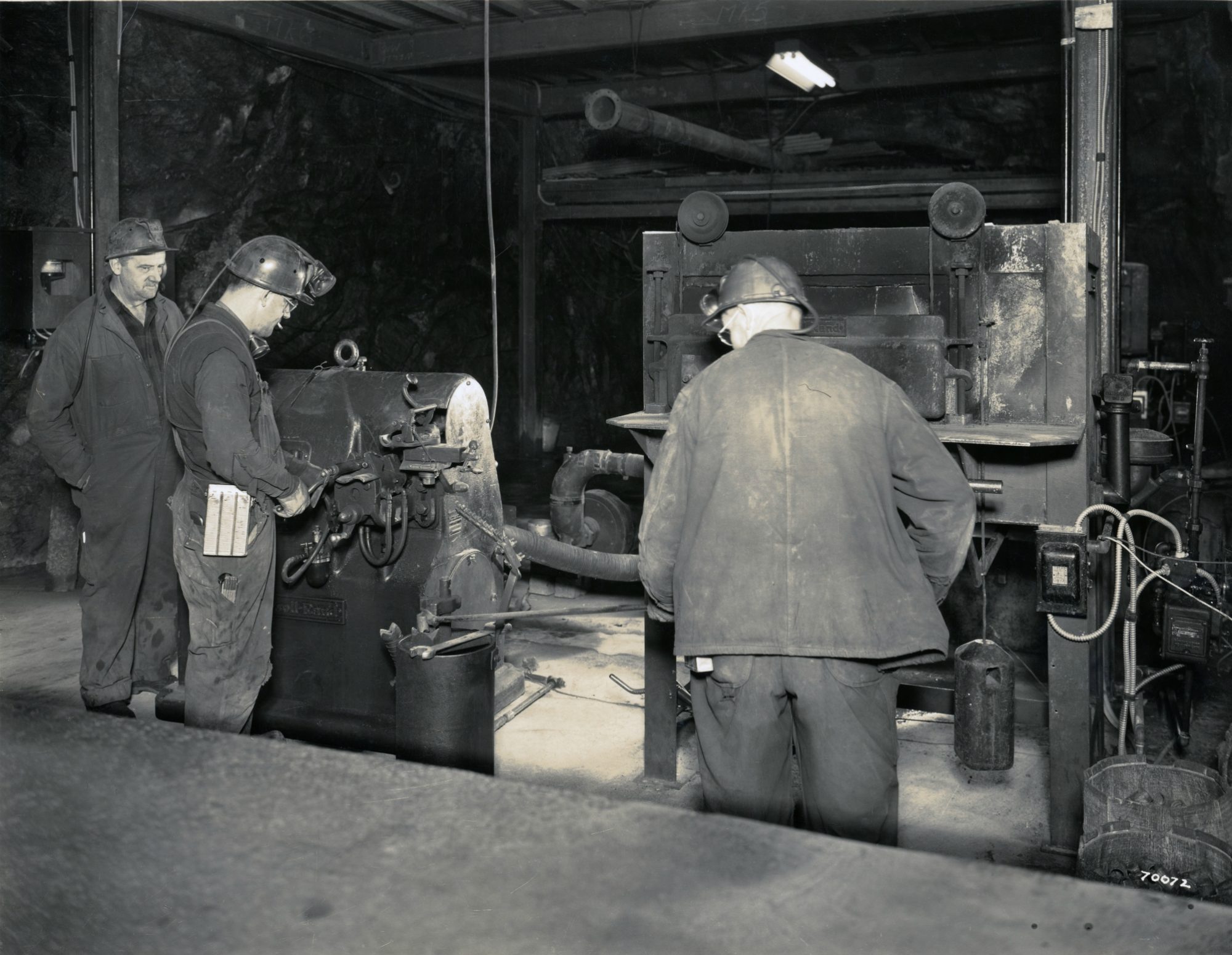 Roy Hicks and Joe Pascal in mine drill shop in Lyon Mountain