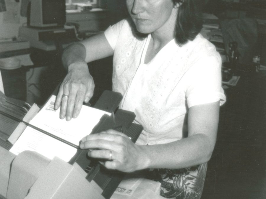Martha Foley vacuums in the record room at NCPR in Canton