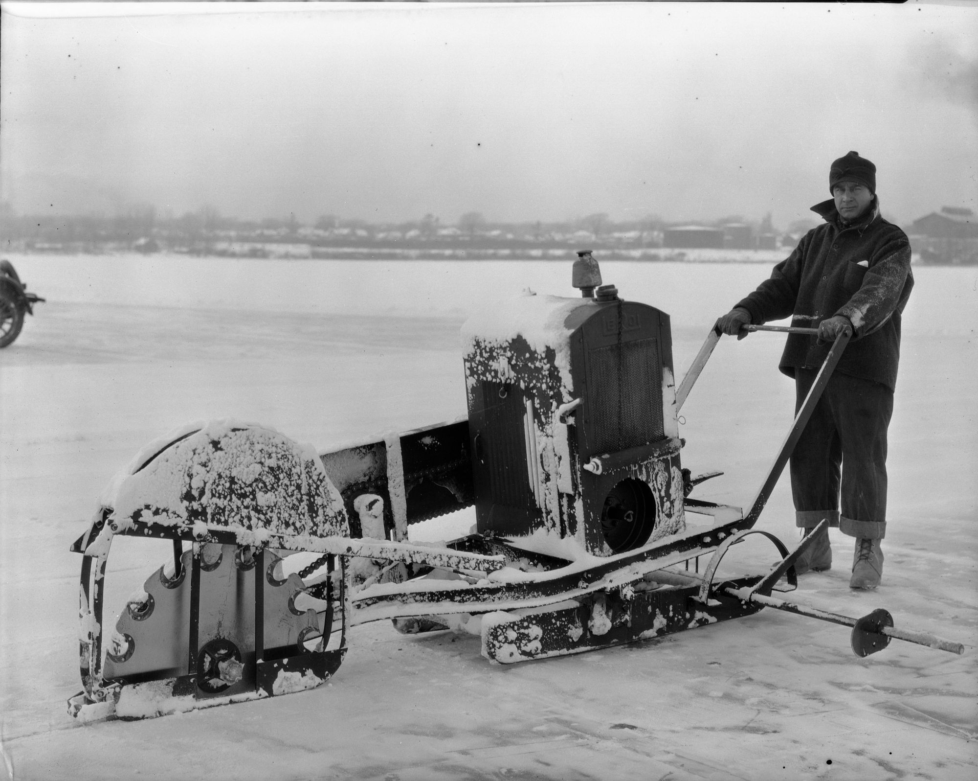 Jabaut Ice Company man uses ice cutting machine in Plattsburgh