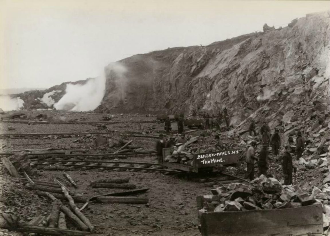 Ore cars being filed in the pit at Benson Mines