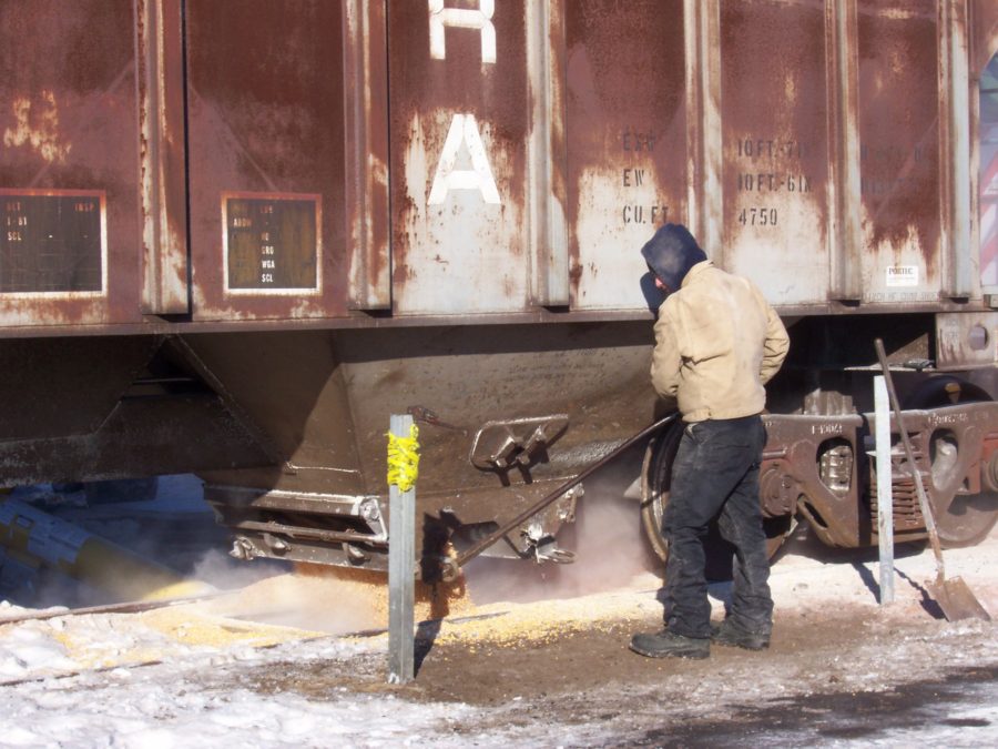 Armstrong and Nolton unloading road salt from rail cars in Ogdensburg