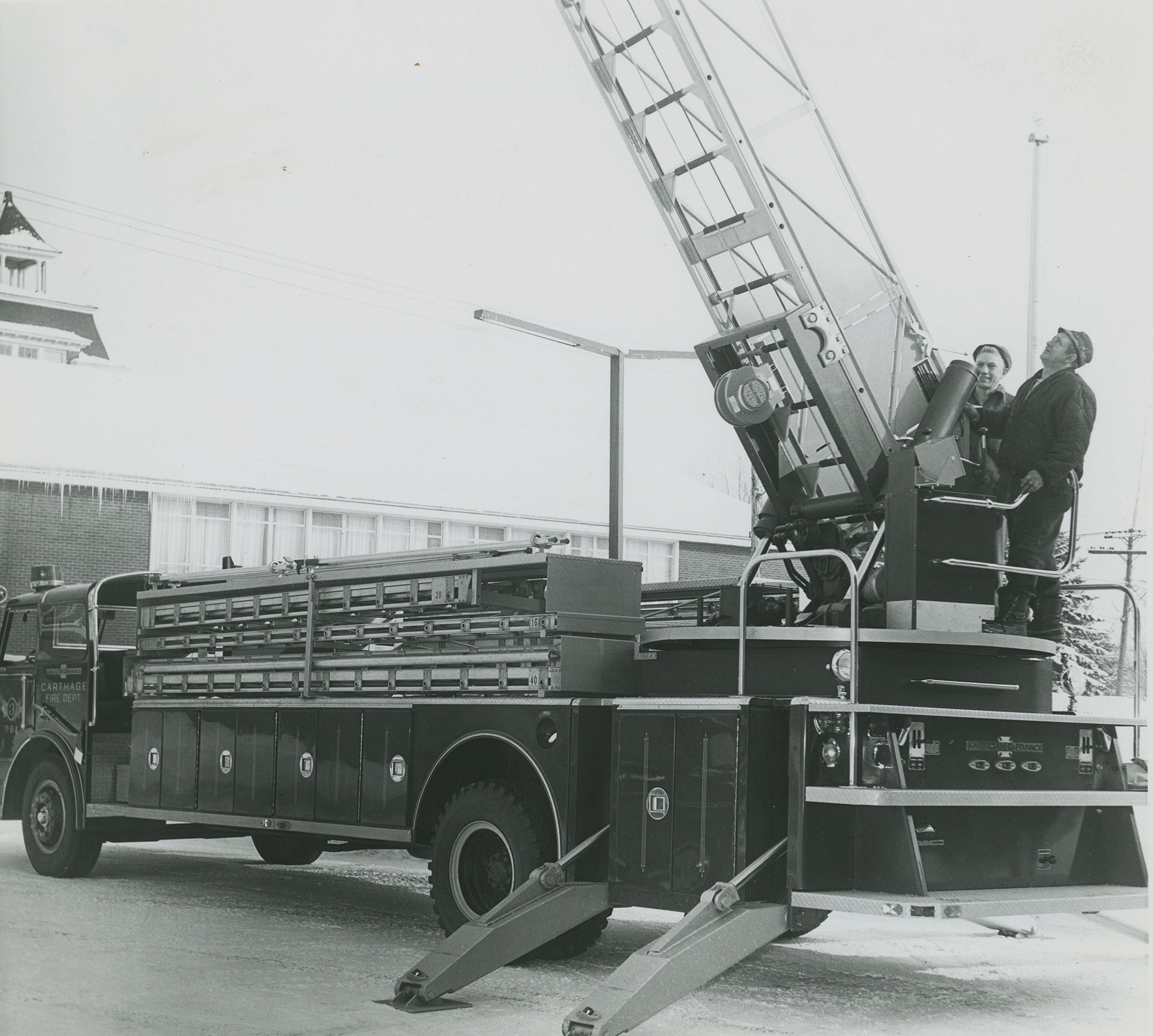 Carthage Fire Chief Richard Buckingham inspecting new ladder
