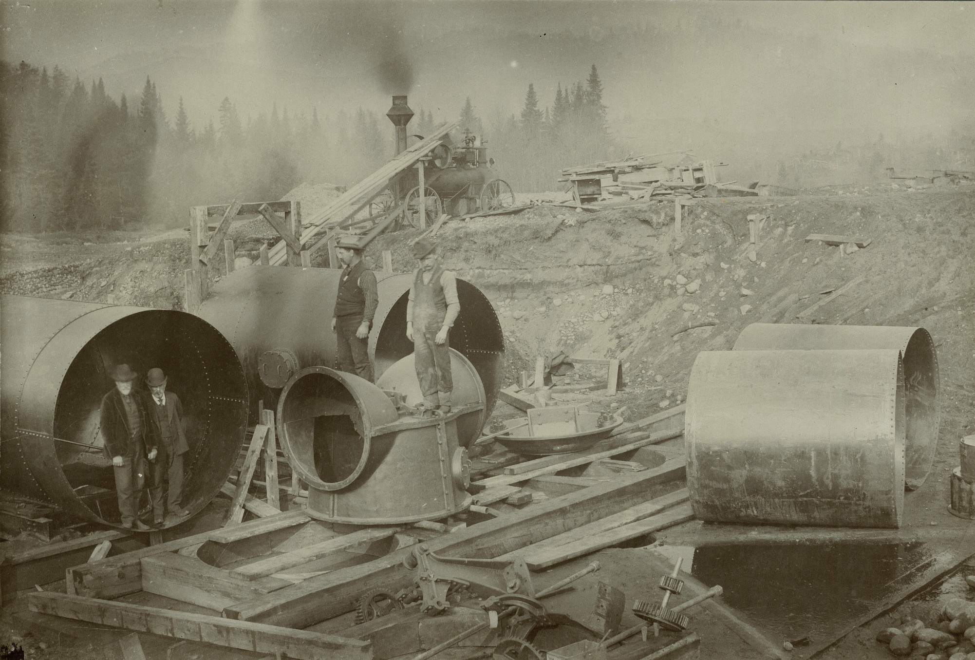 Paul Smith and other men at construction site in Paul Smiths