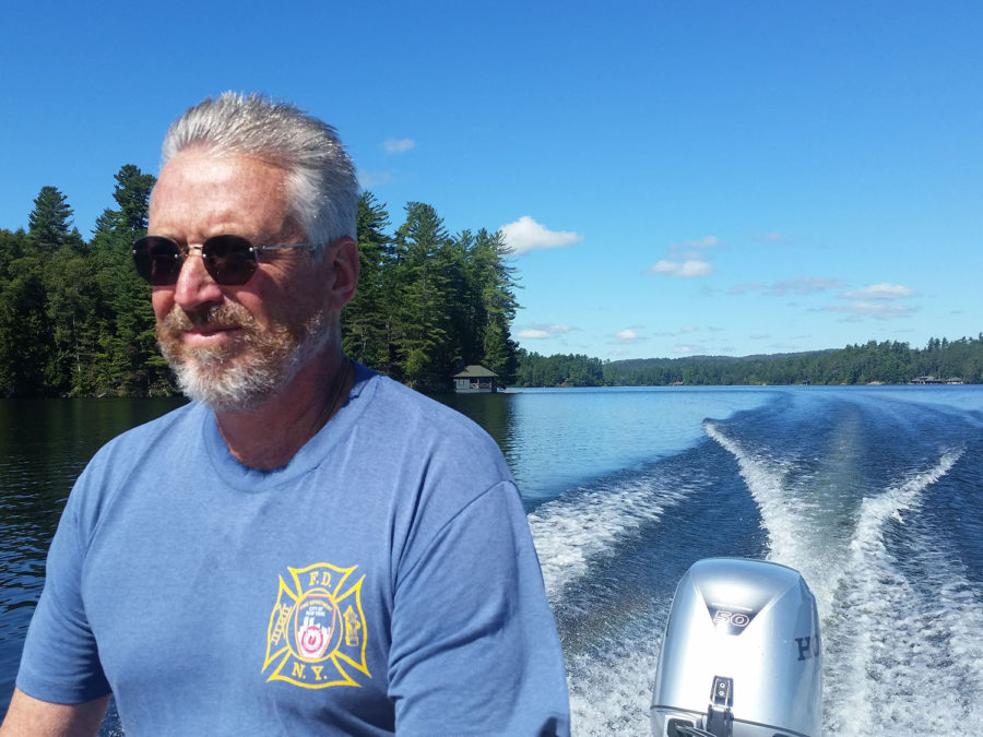 Caretaker Seth Rozon at Schimmel Camp on Rondaxe Lake near Old Forge