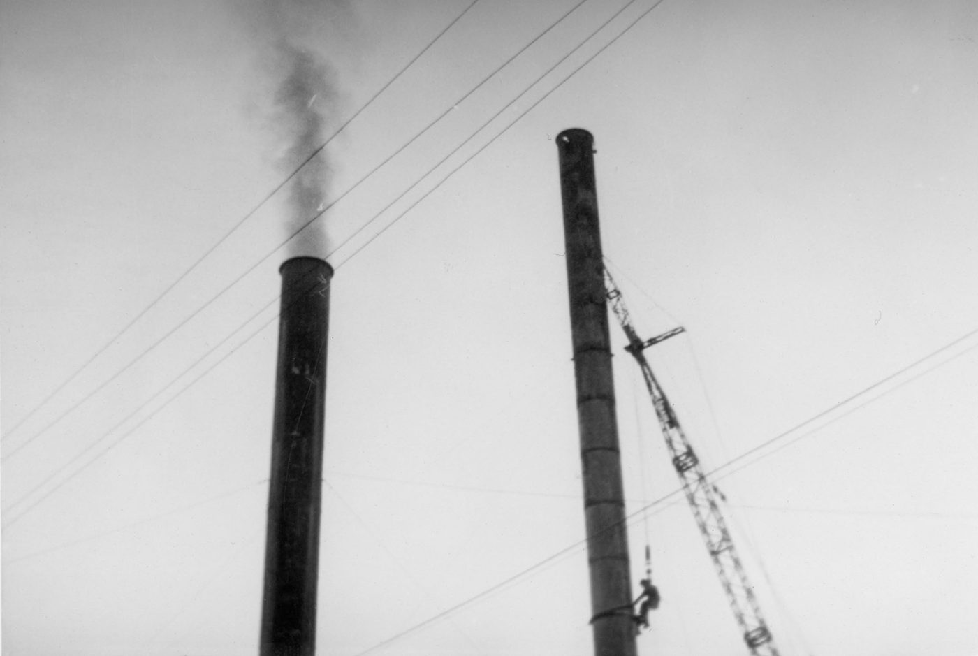 Worker atop a smokestack at a coal plant in Plattsburgh