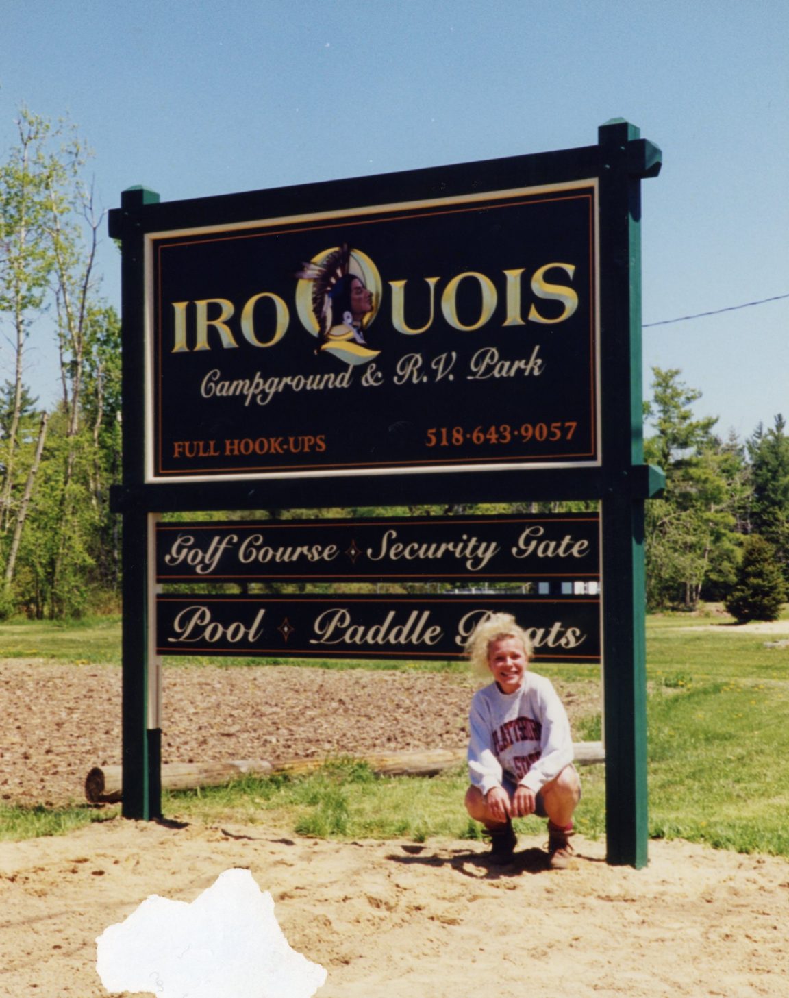 Sign-builder KC Reiter with the Iroquois Campground sign in Peru