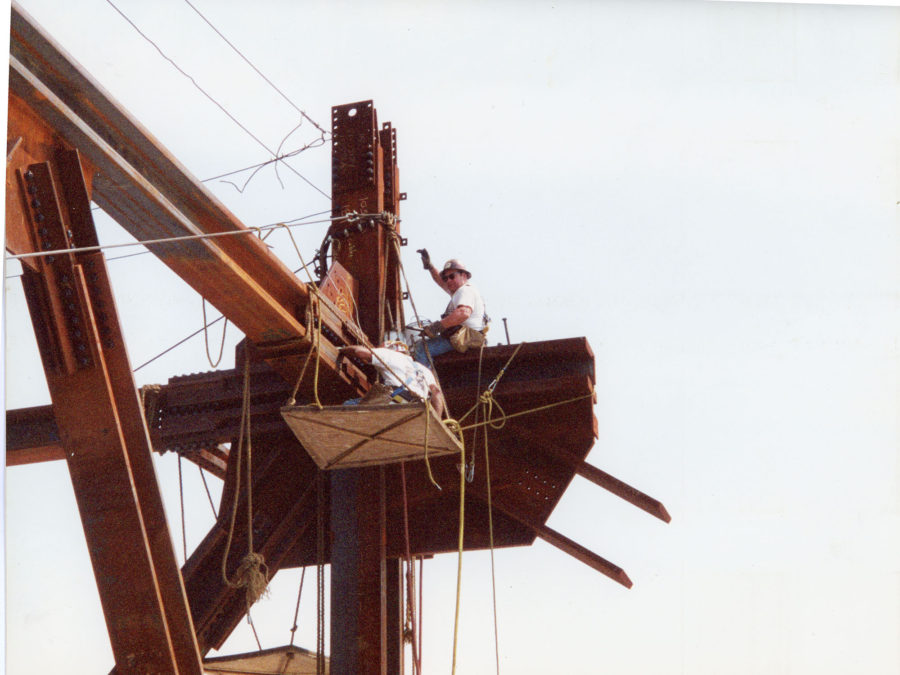 Mohawk ironworkers on a beam overlooking NYC