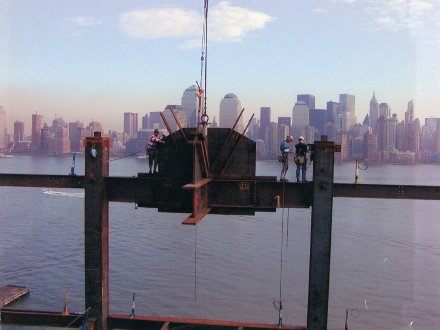 Mohawk ironworkers on a beam overlooking NYC