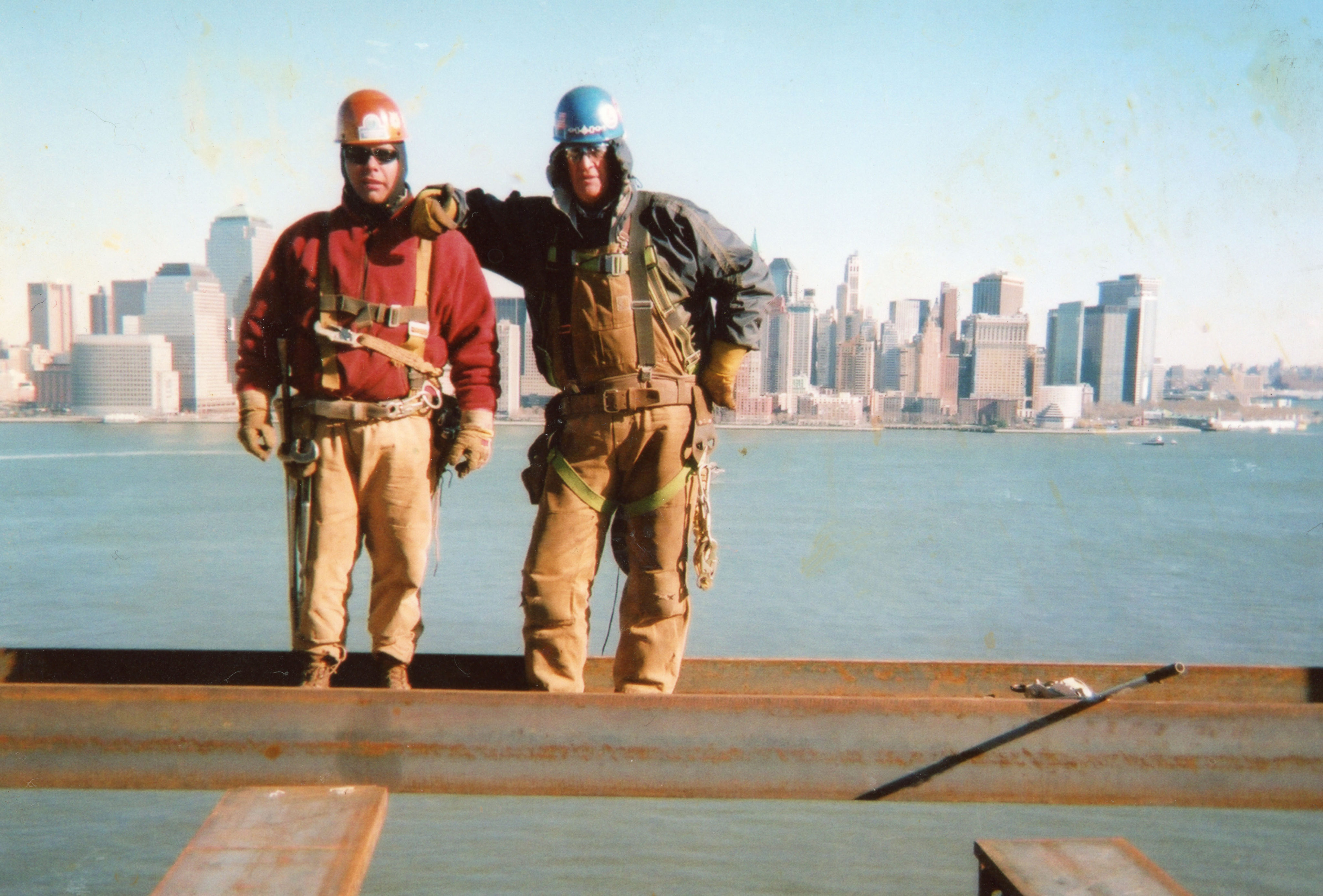 Mohawk ironworkers on a beam overlooking NYC