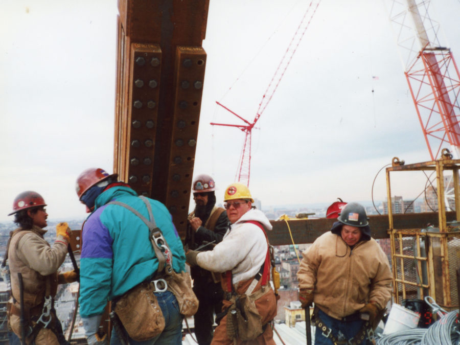 Mohawk ironworkers on a beam overlooking NYC