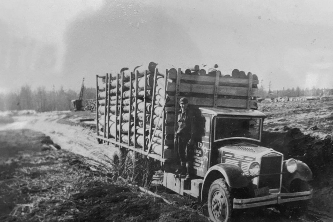 Harold Champney hauling timber for Carl Tracy’s trucking company in ...